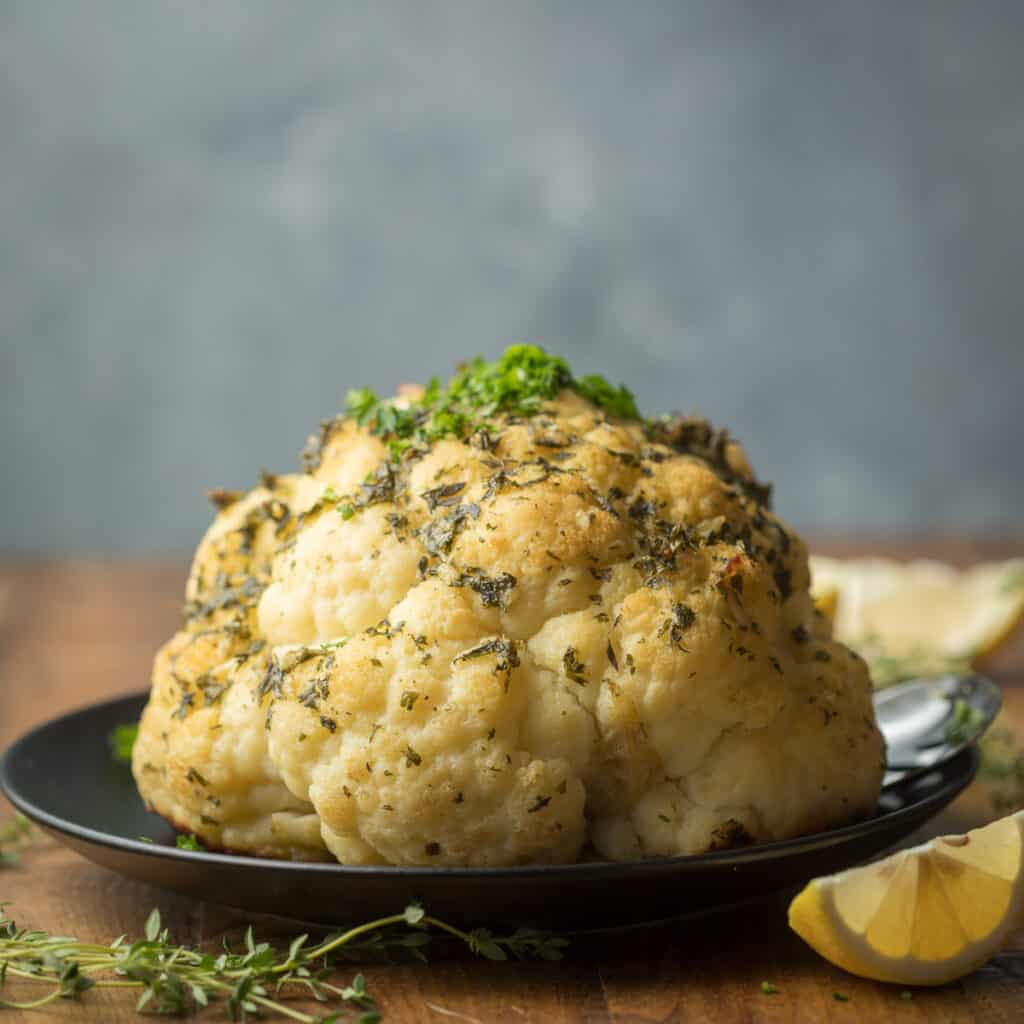 Garlic & Herb Crusted Whole Roasted Cauliflower - Connoisseurus Veg