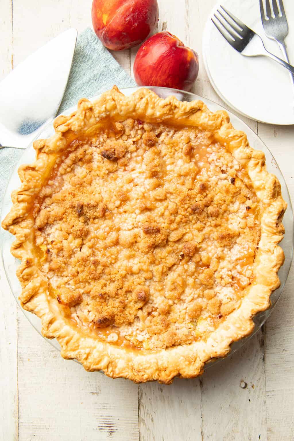 Vegan Peach Pie with Crumble Topping - Connoisseurus Veg